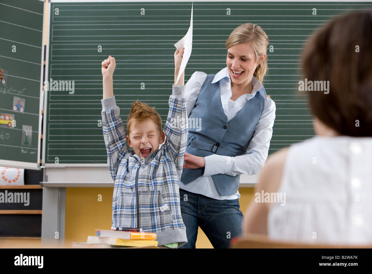 Boy celebrating grade Stock Photo - Alamy