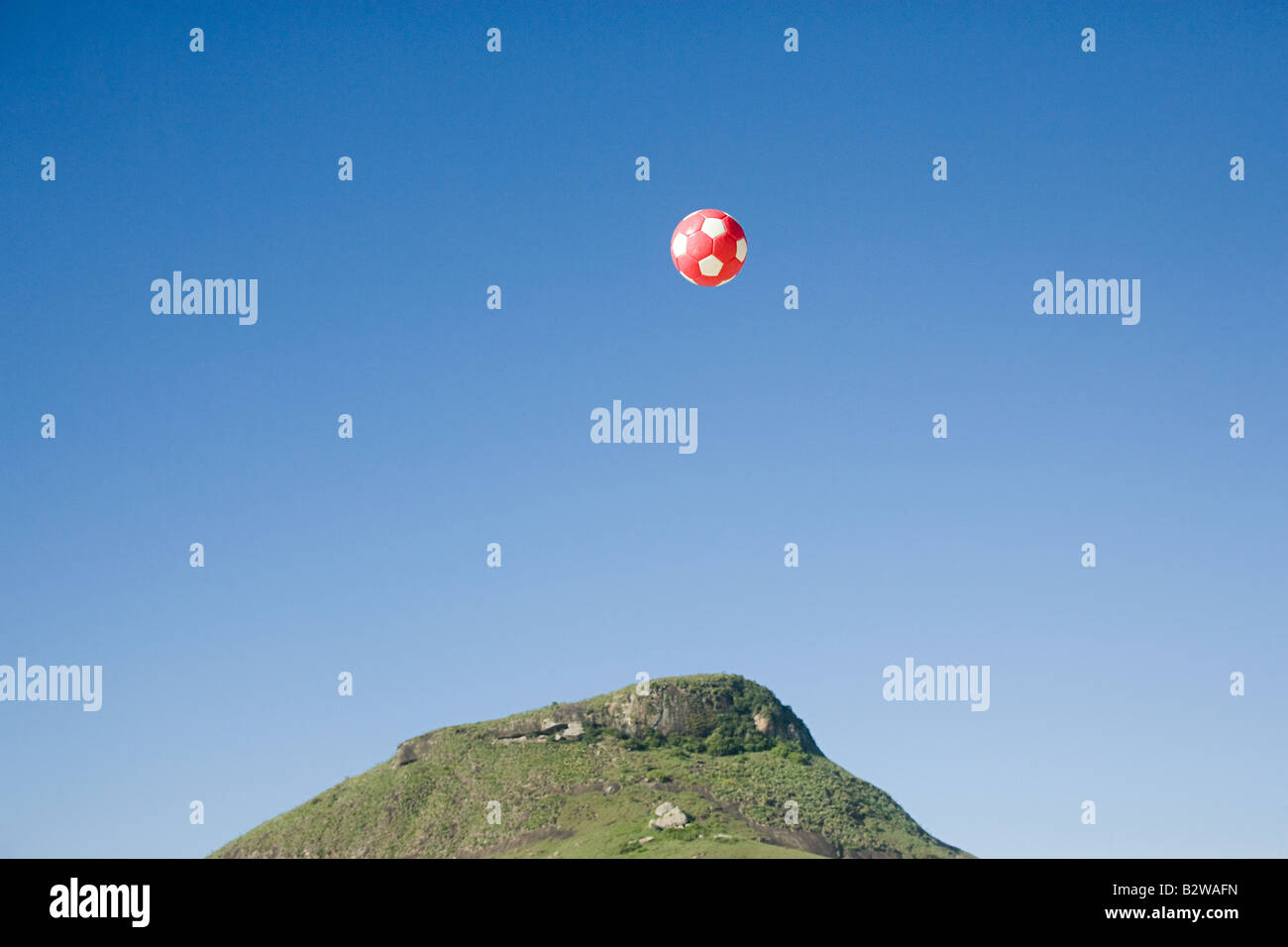 A football in mid air Stock Photo - Alamy