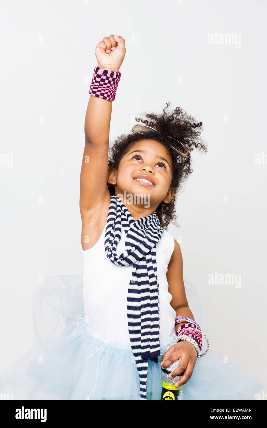 Portrait of a girl raising her arm Stock Photo - Alamy