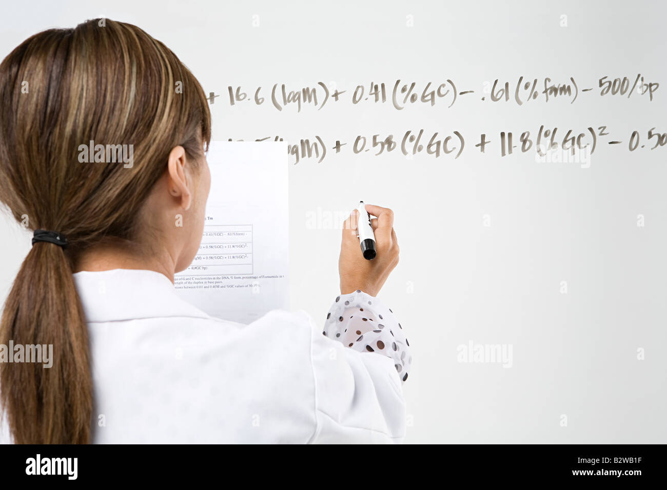 Scientist writing formula Stock Photo - Alamy