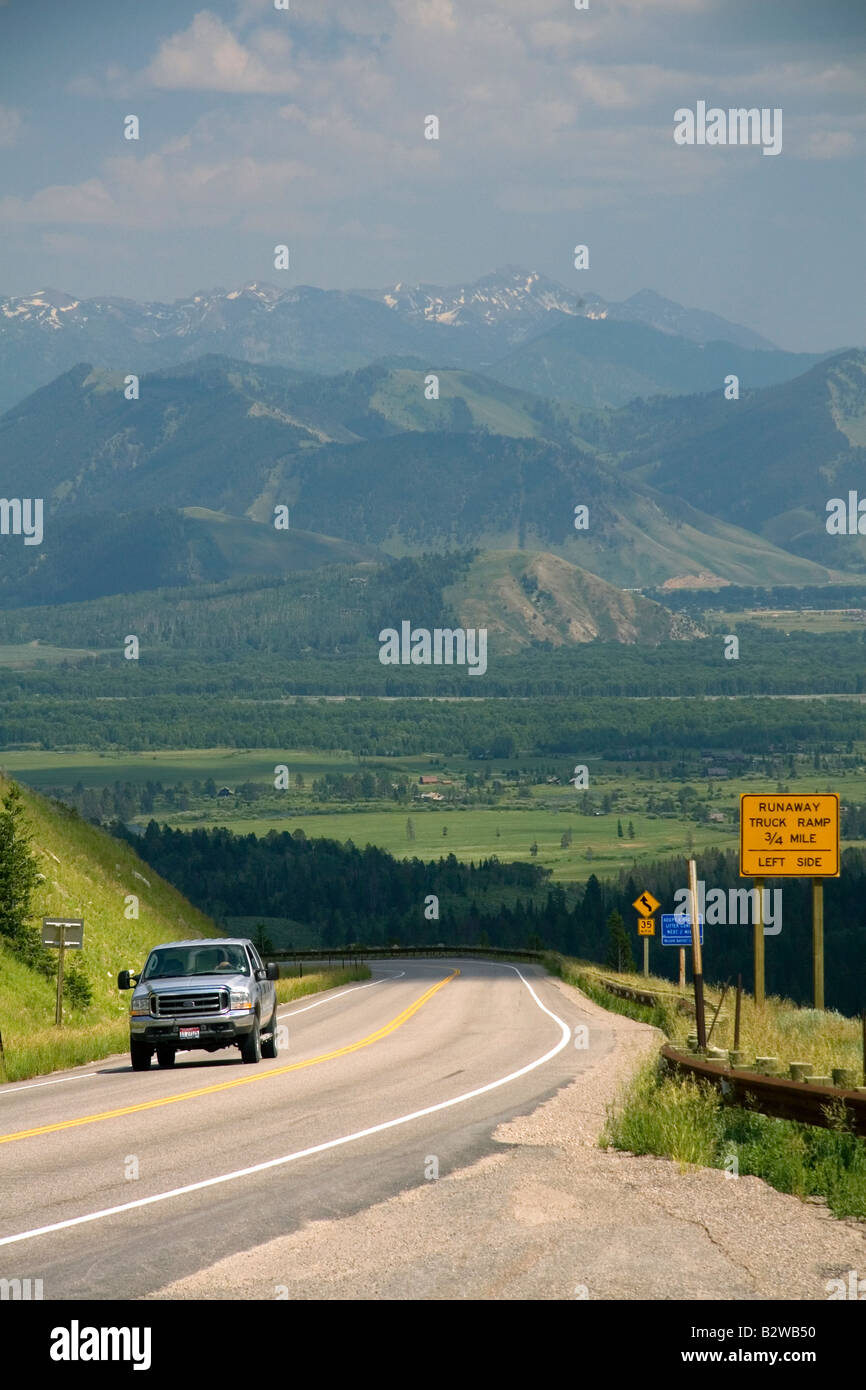 A truck traveling over the high mountain Teton Pass on Wyoming Highway ...
