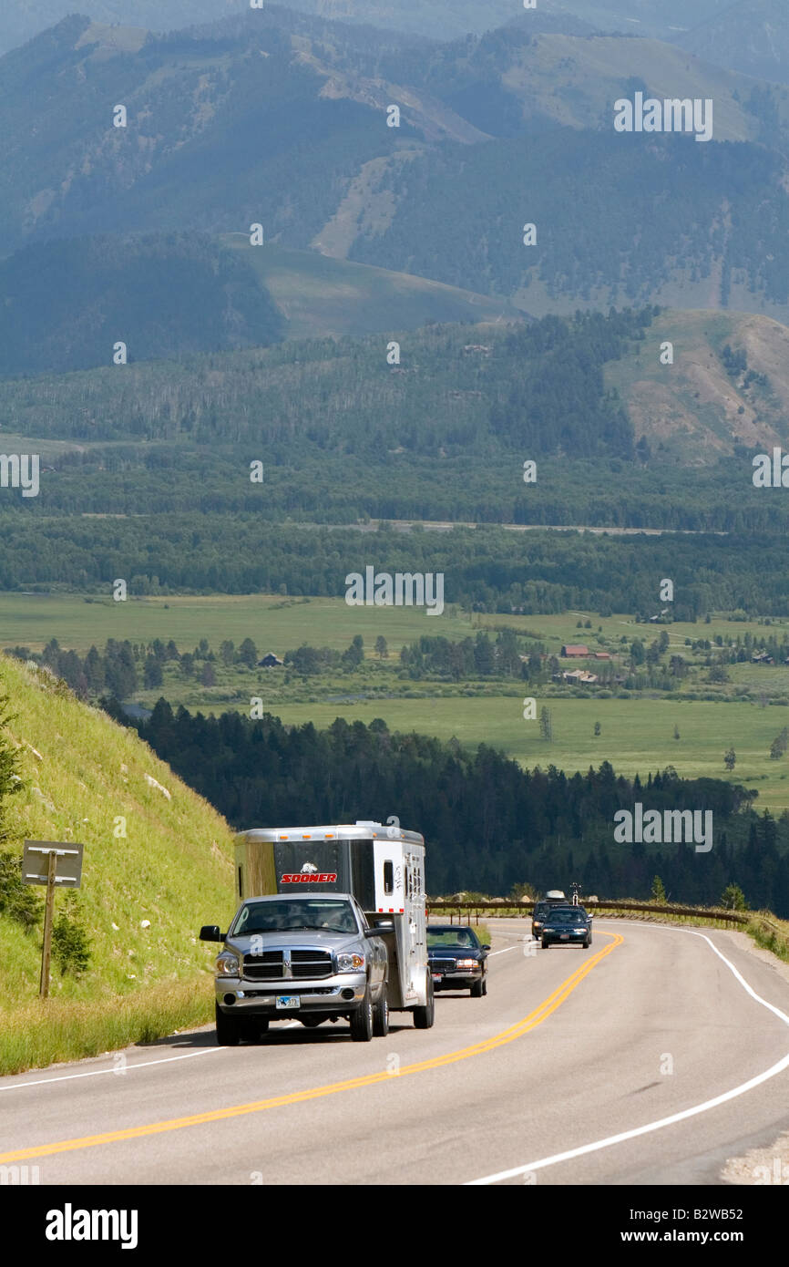 Vehicles travel over the high mountain Teton Pass on Wyoming Highway 22 ...