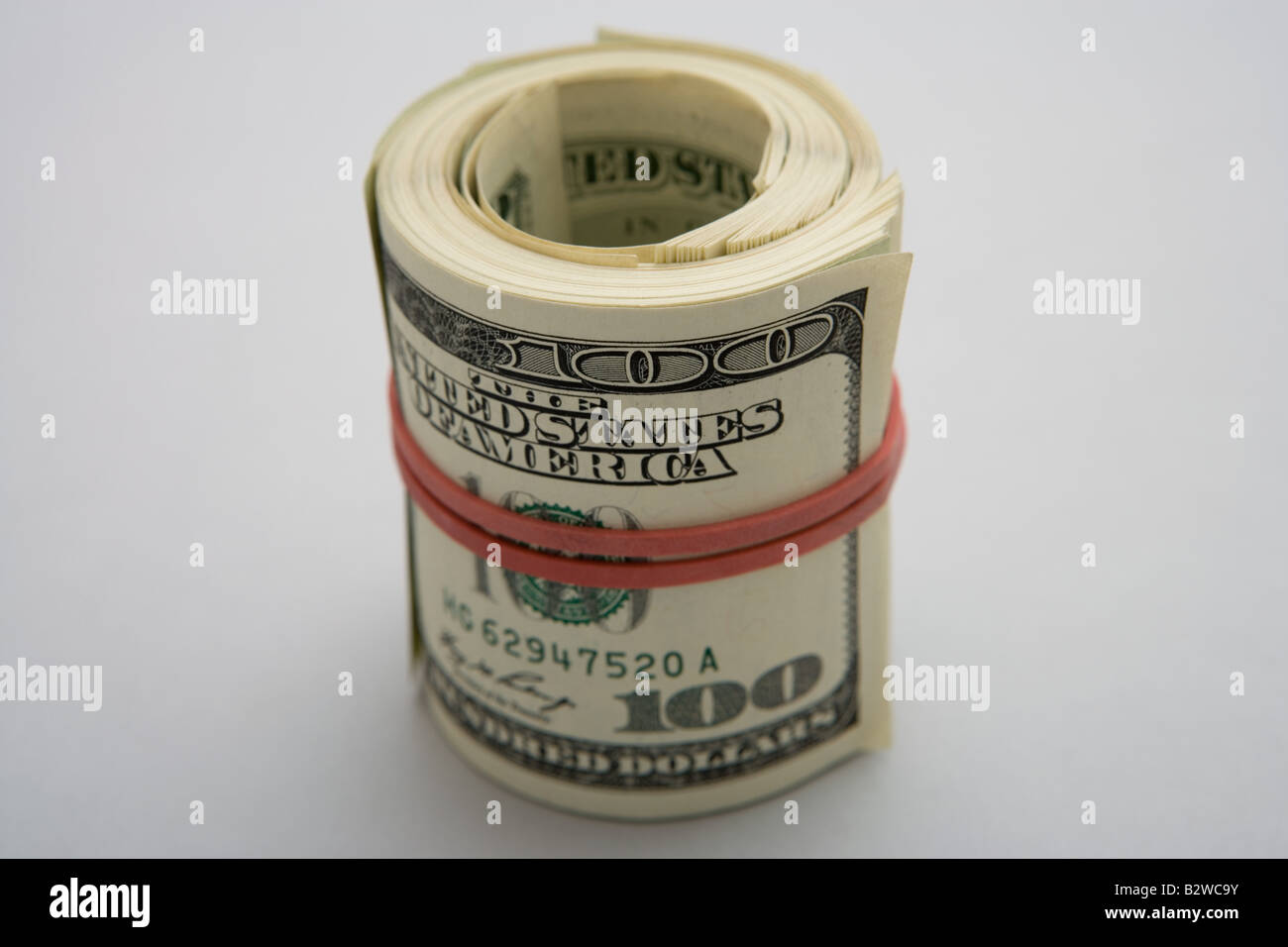 Roll of banknotes Stock Photo - Alamy