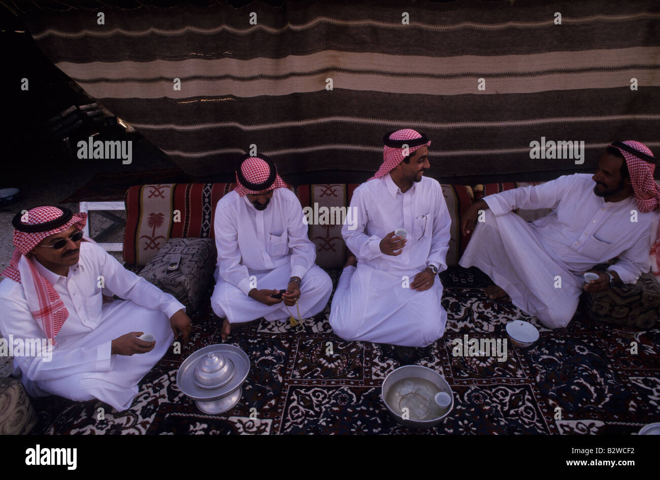 Saudi men drinking hi-res stock photography and images - Alamy