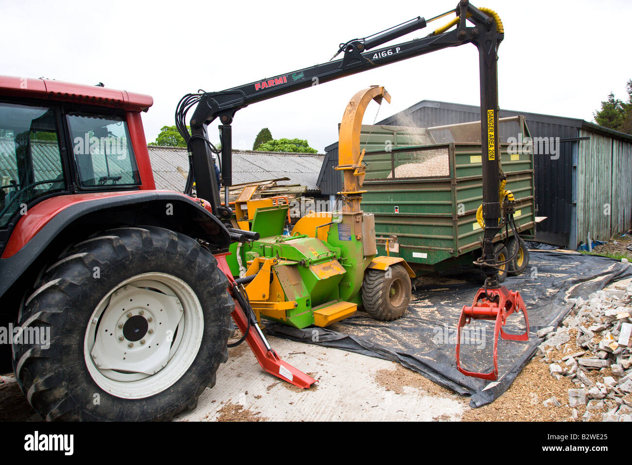 chipping wood for use in a wood chip burner Stock Photo - Alamy