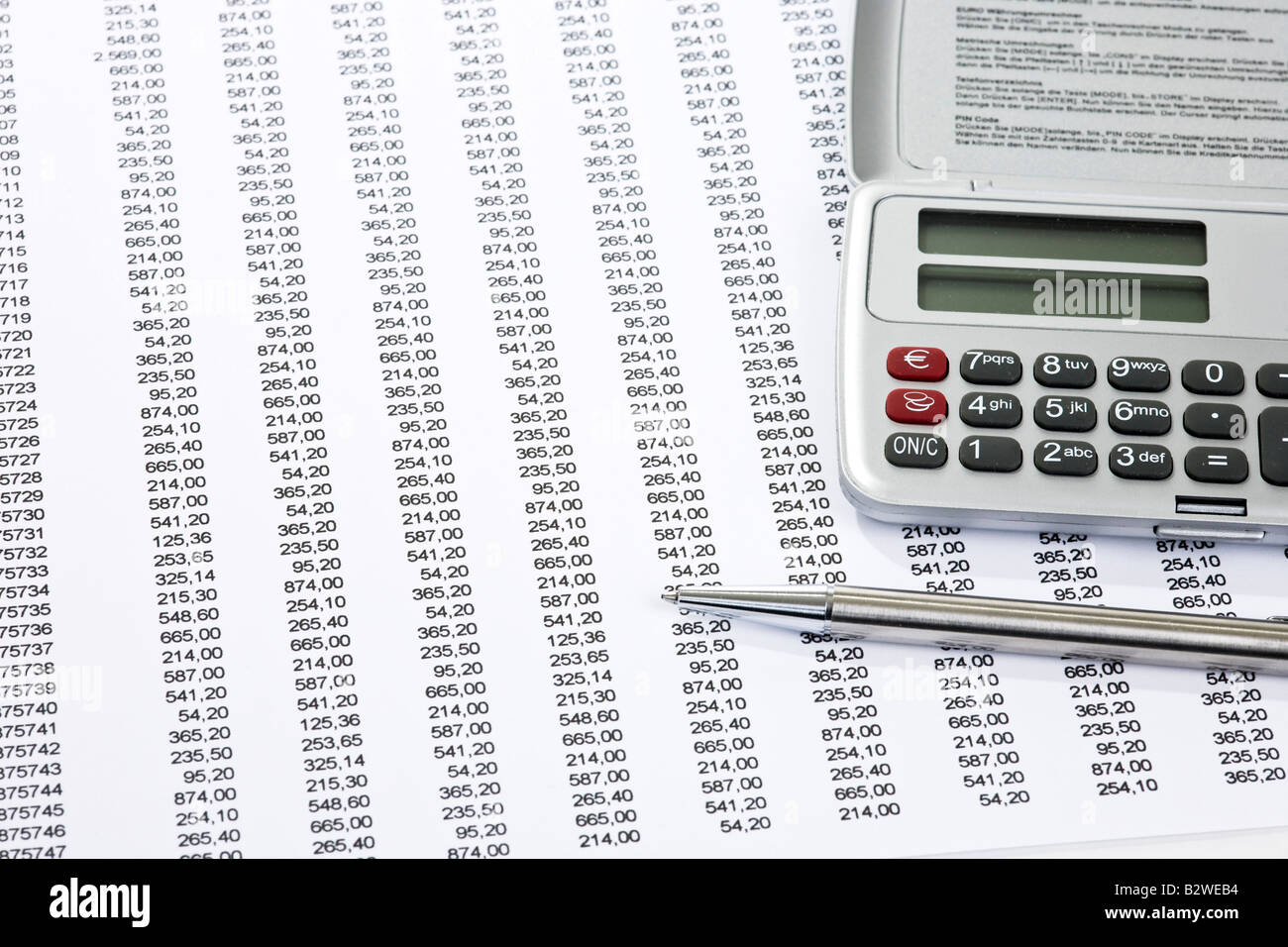 Numerical data with calculator und ball pen - white background Stock ...