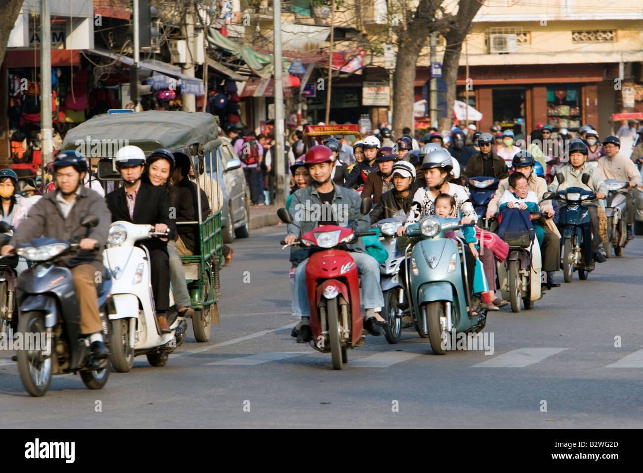 Motorcycles crowd streets of Hanoi Vietnam Stock Photo - Alamy