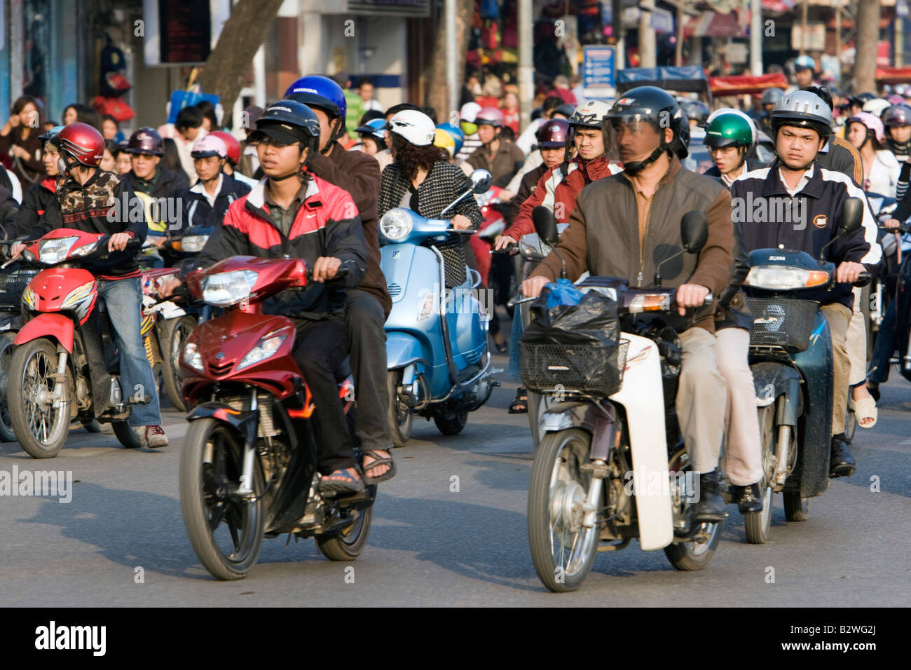 Motorcycles crowd streets of Hanoi Vietnam Stock Photo - Alamy