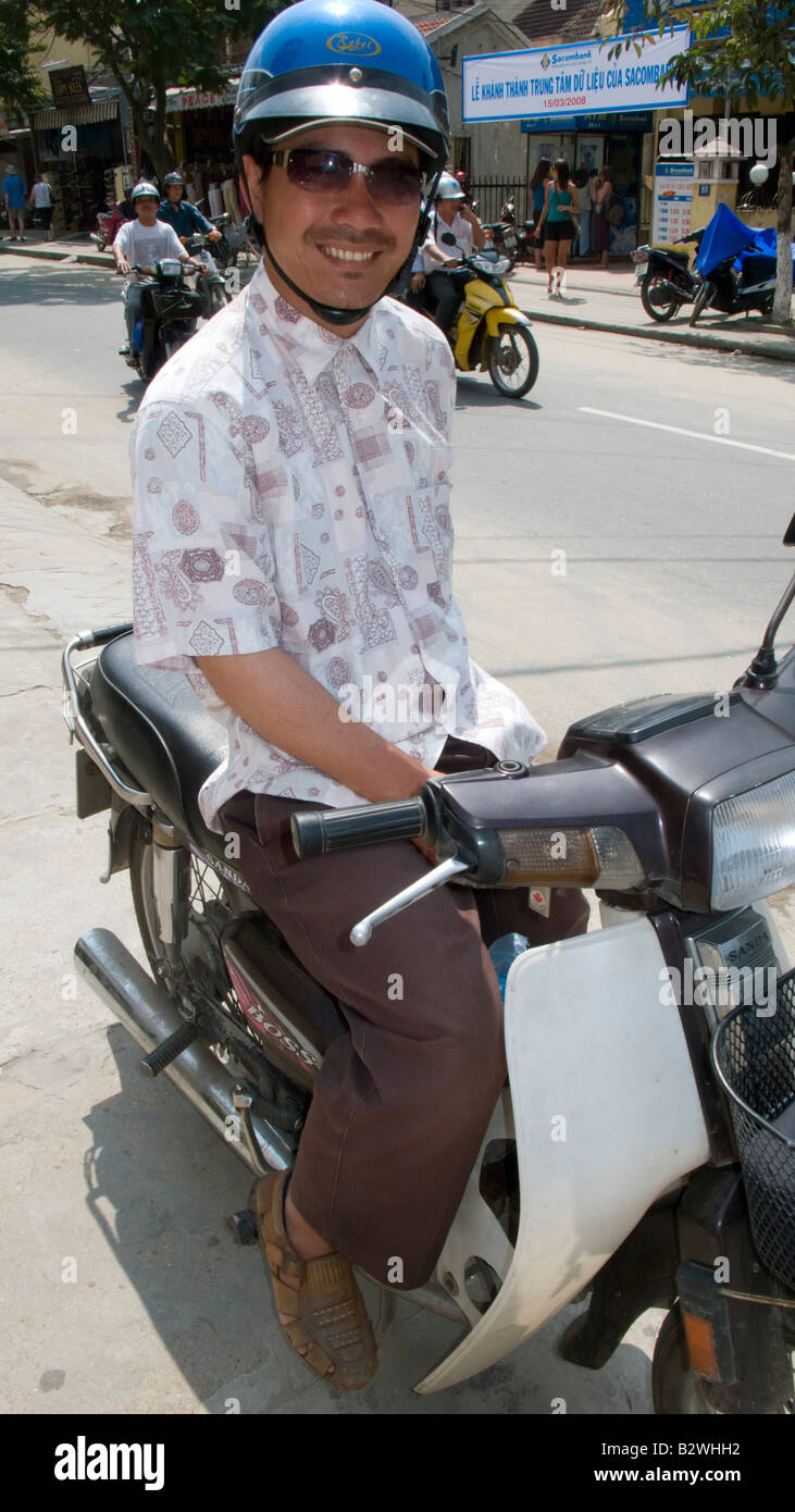 Motorcycle taxi driver historic Hoi An Vietnam Stock Photo - Alamy