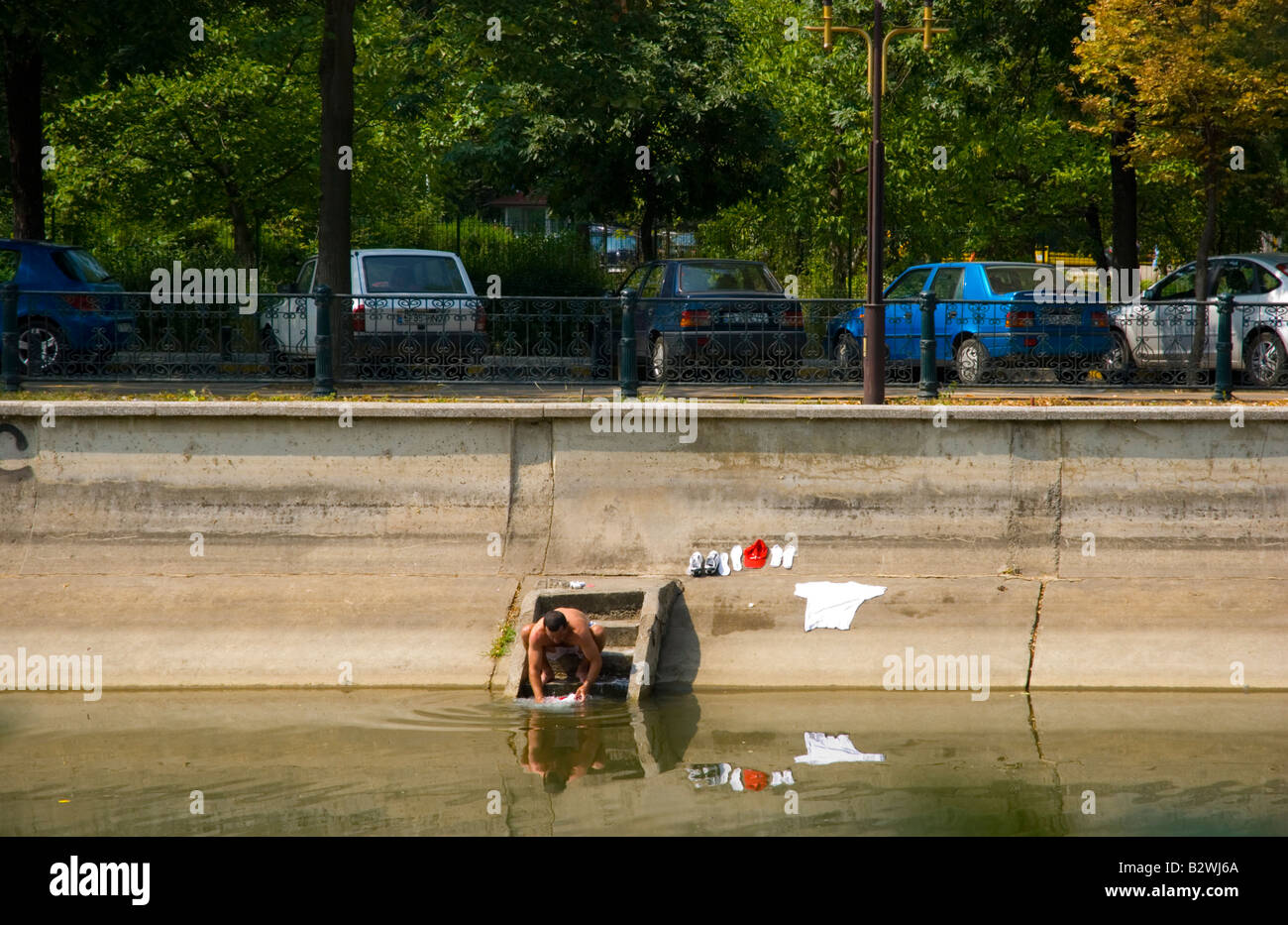 Man washing clothes river in hi-res stock photography and images - Alamy