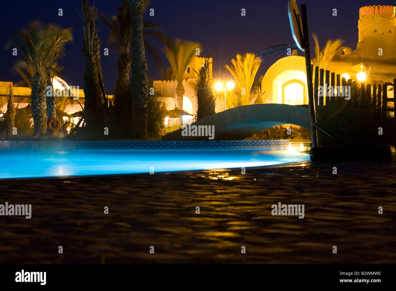 Pool at the hotel resort illuminated by the night lights Stock Photo ...