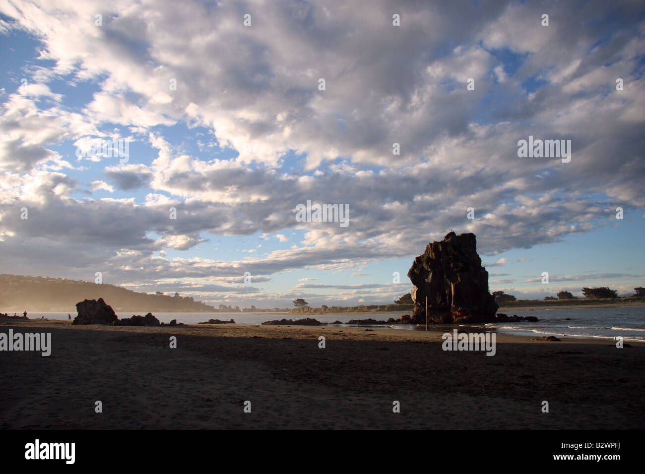 'Rapanui' / 'Shag Rock' illuminated as the sun sets over the beach in ...