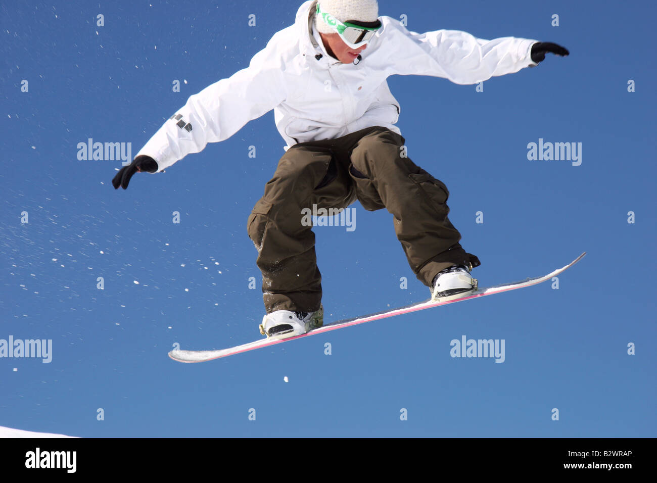 A snowboarder gets good air off a jump in the Portes du Soleil ski area ...