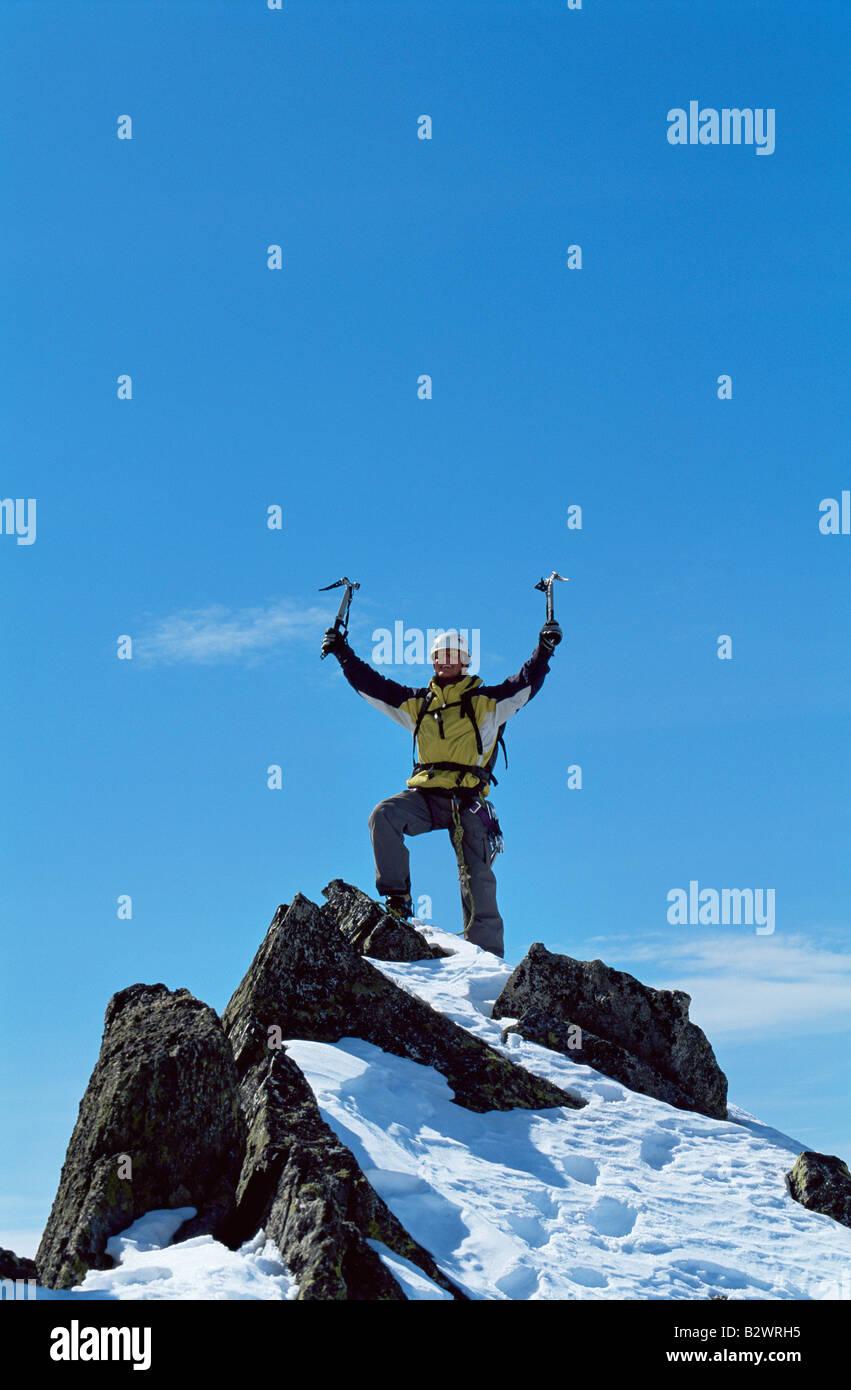 Victorious mountain climber hi-res stock photography and images - Alamy