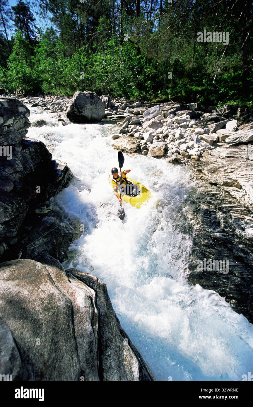 Kayaker in rapids going over waterfall Stock Photo - Alamy