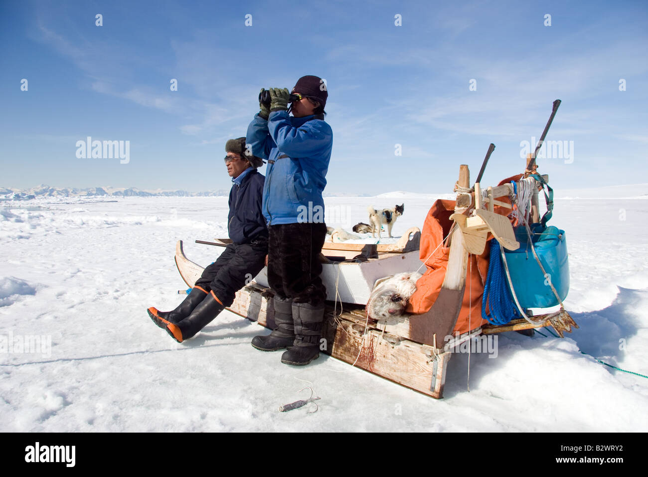 Inuit hunters watch for life at the ice edge near Cape Swainson ...