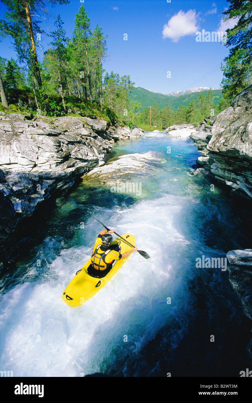 Kayaker rowing in rapids Stock Photo - Alamy