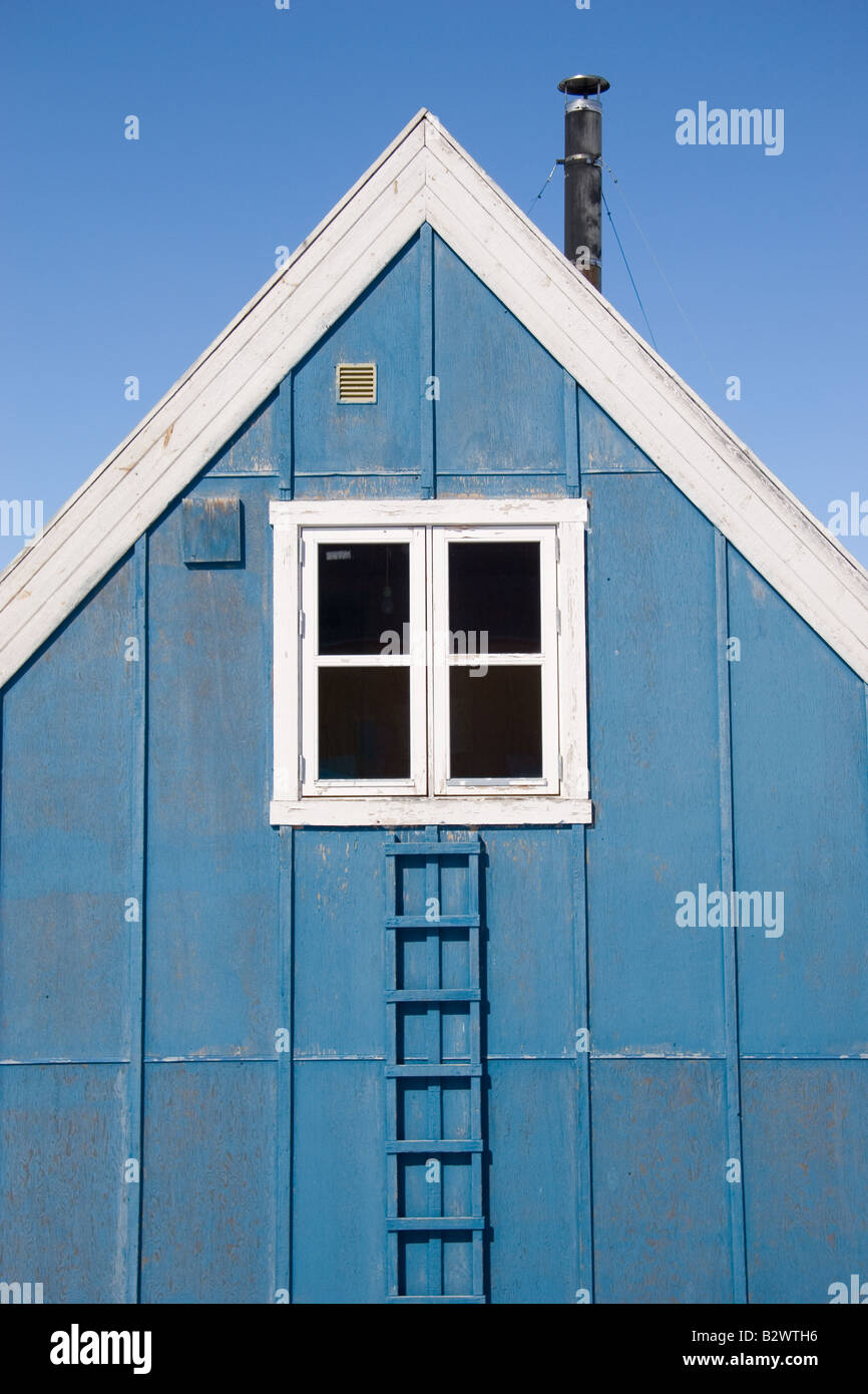 A traditional Greenlandic blue-painted wooden house in the village of ...