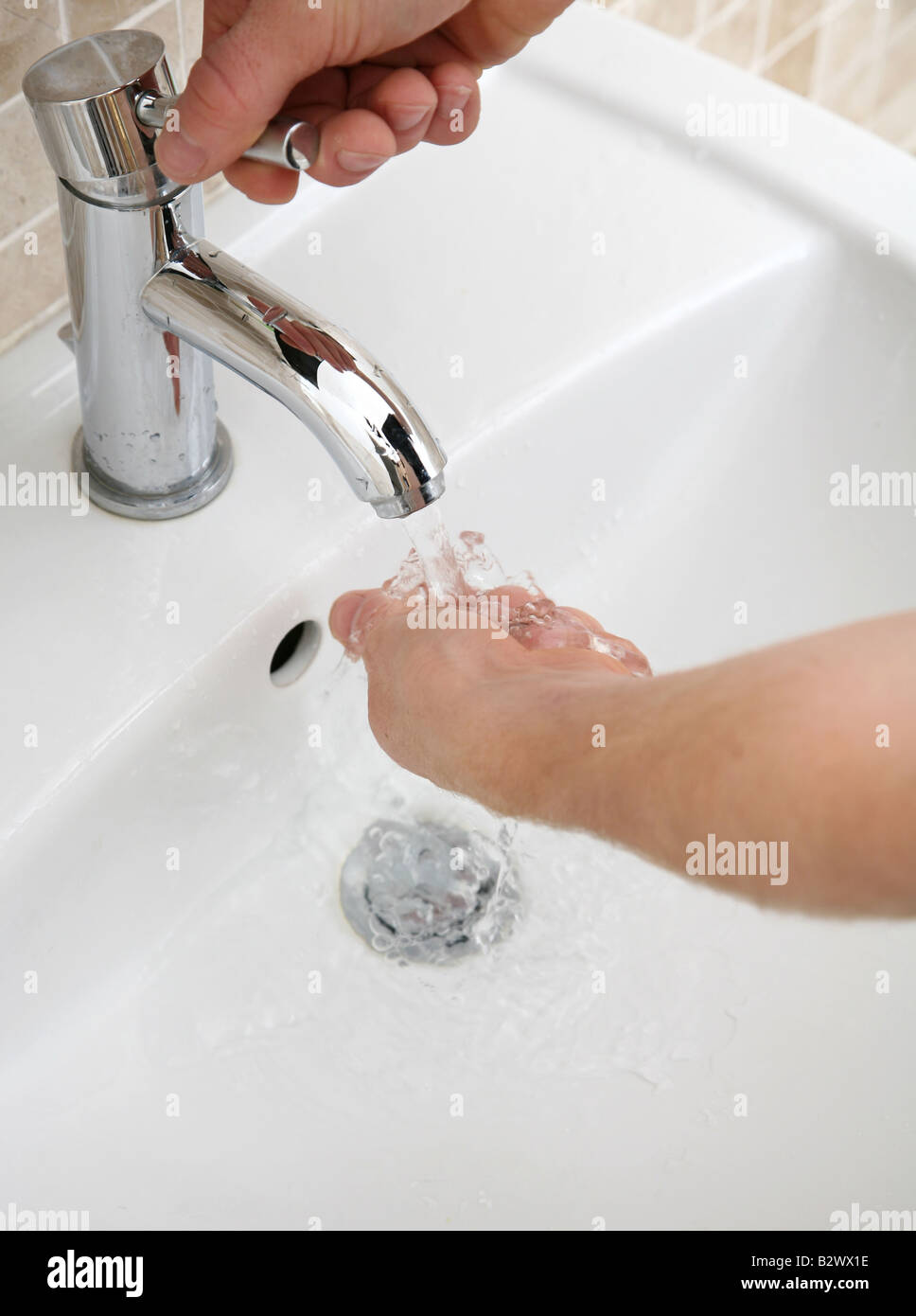 person washing their hands Stock Photo - Alamy