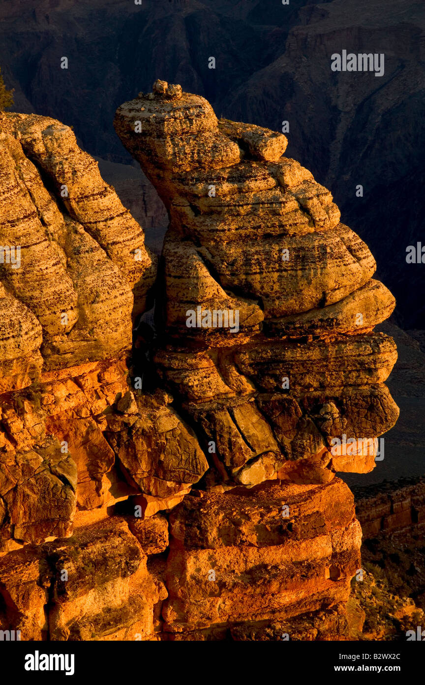 A split rock formation is warmed at sunrise near the south rim of the ...