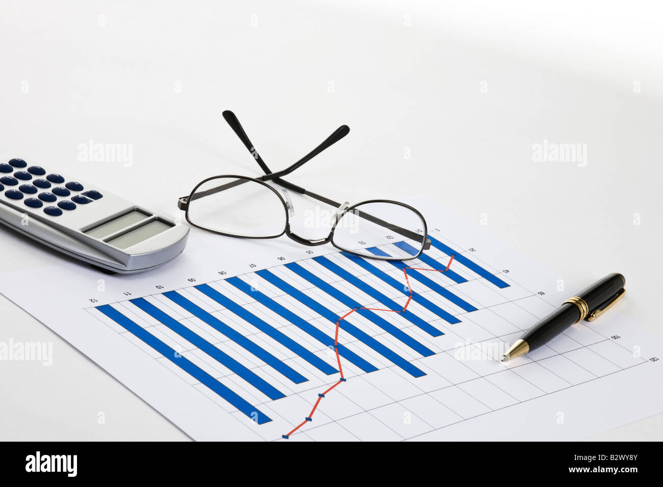 Bar chart on white paper with glasses and pen Stock Photo - Alamy