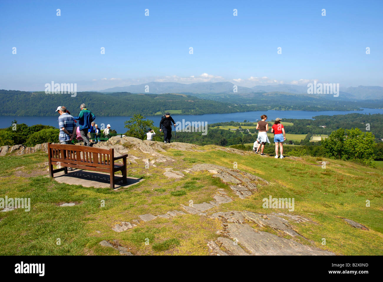 Group of walkers relaxing on Orrest Head overlooking Lake Windermere ...