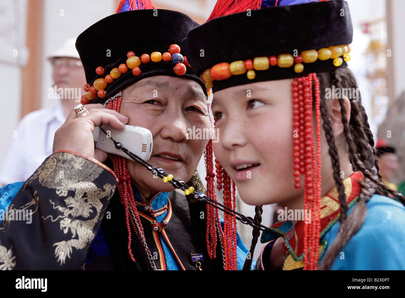 A mother uses her daughter's mobile phone, Mongolia, Asia Stock Photo ...