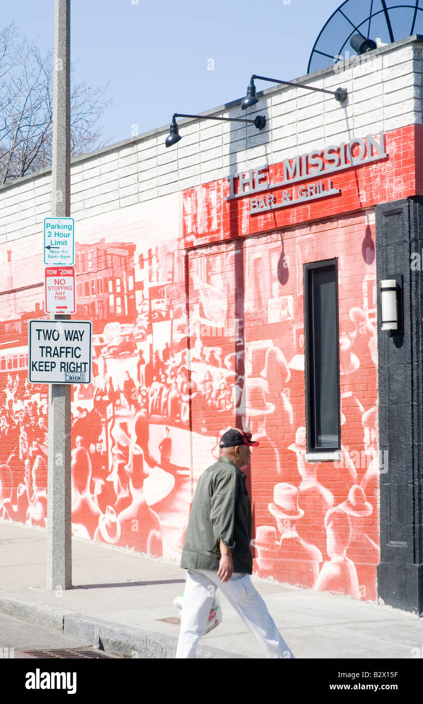 man passing a mural in Mission Hill Boston MA USA Stock Photo - Alamy