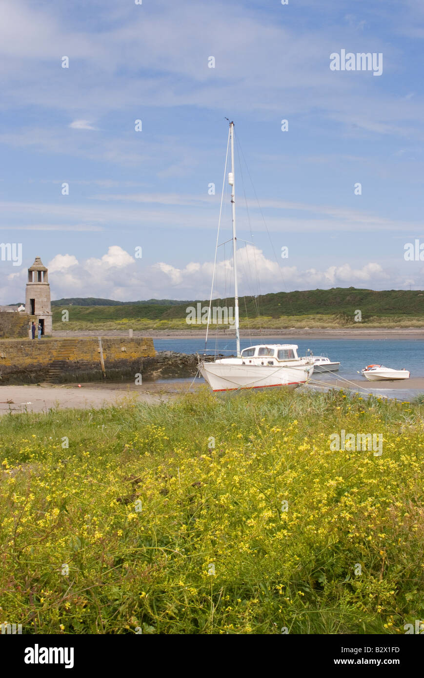 The Stone Pier and Old Granite Lighthouse at Port Logan Harbour with ...