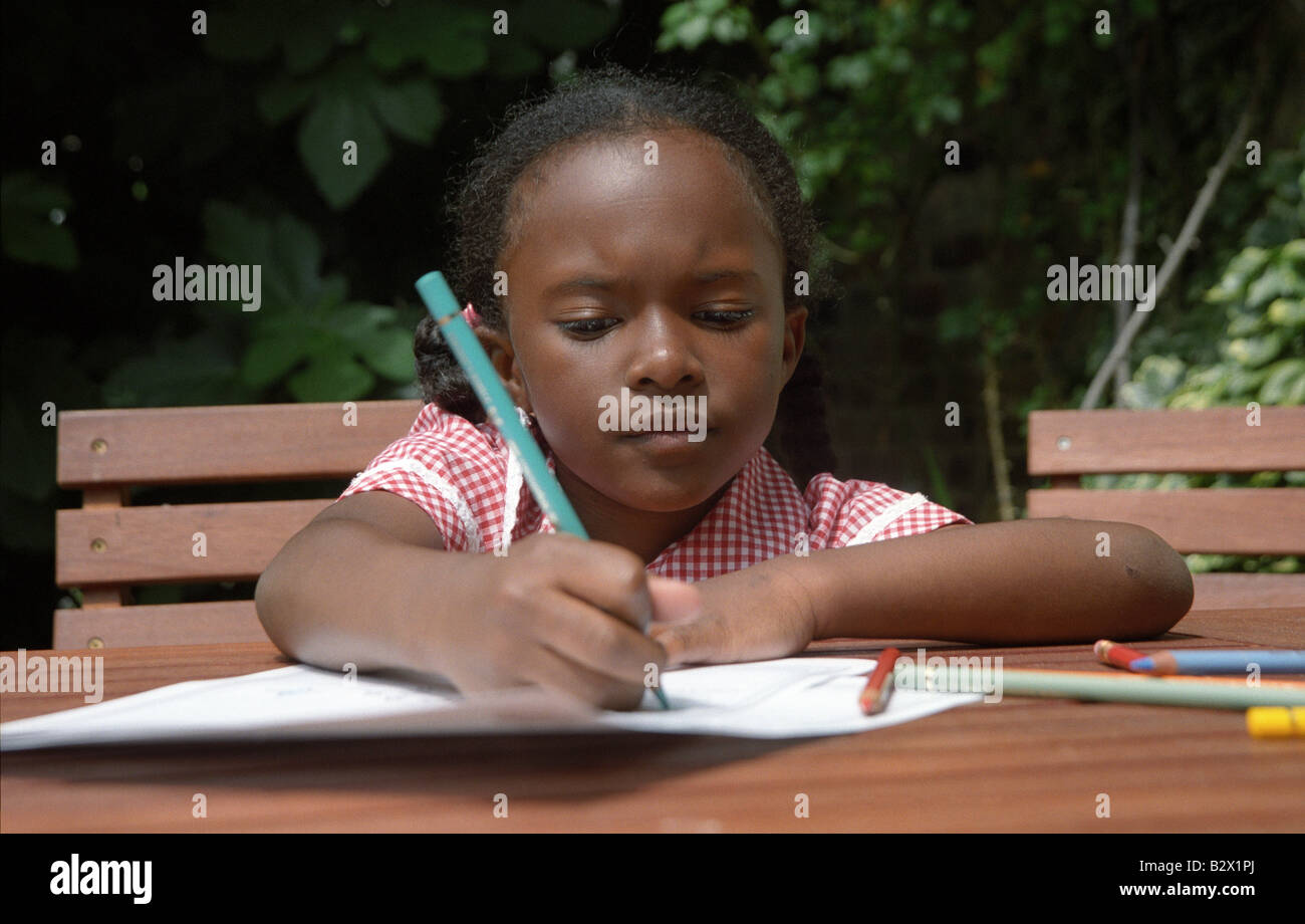 Little black girl doing her homework Stock Photo - Alamy