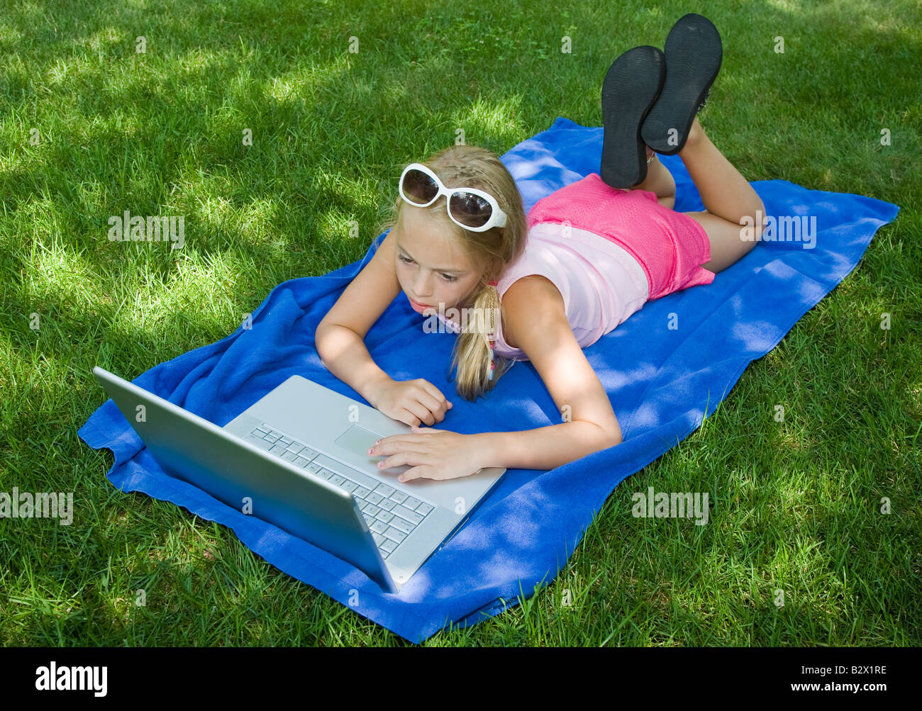 Child working on her laptop Stock Photo - Alamy