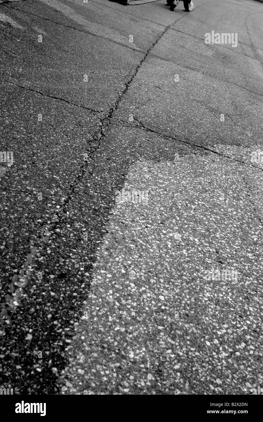 Wet and dry asphalt on a curved road Stock Photo - Alamy