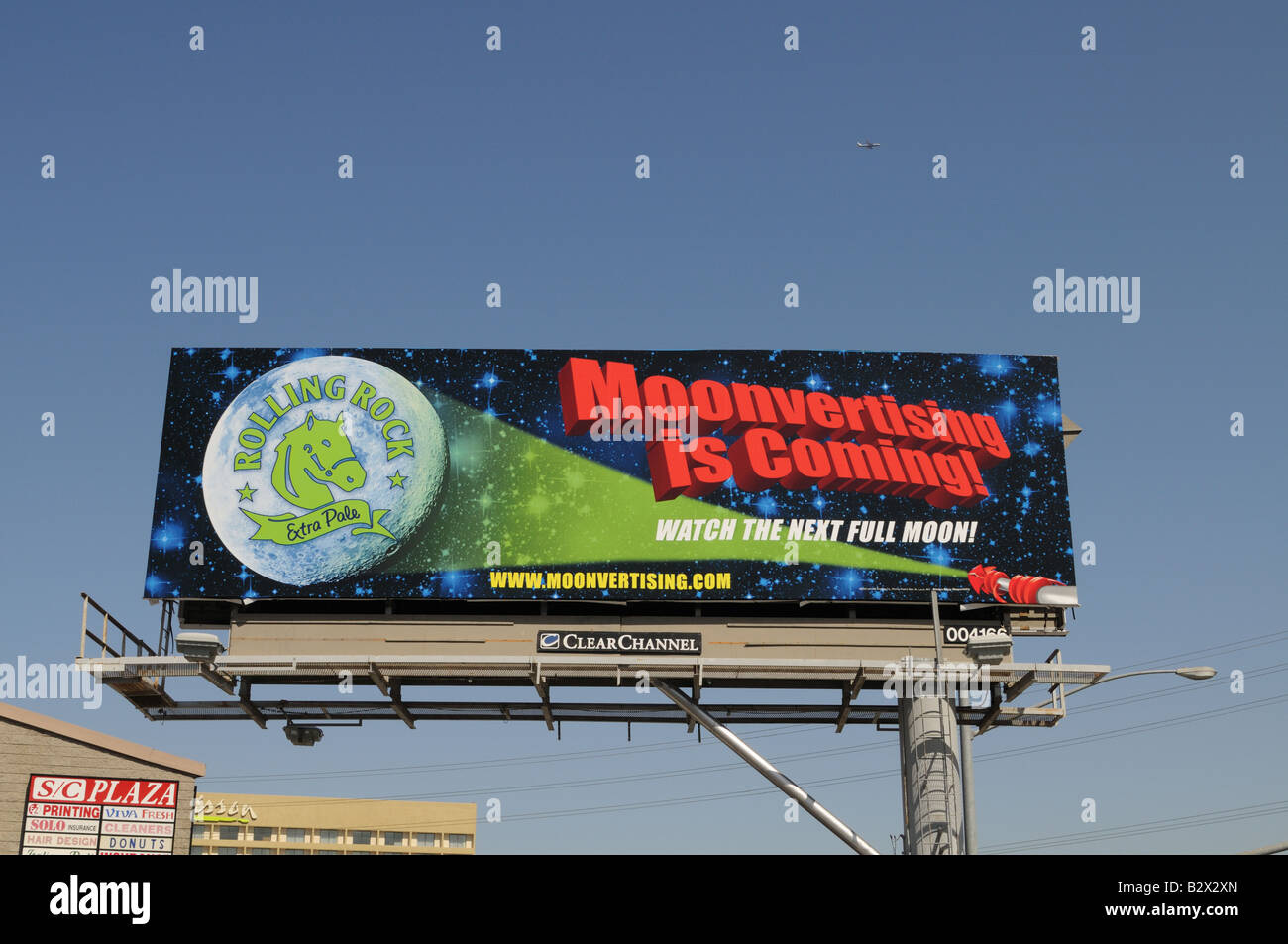 Billboard advertising coming advertising of beverage on surface of moon ...