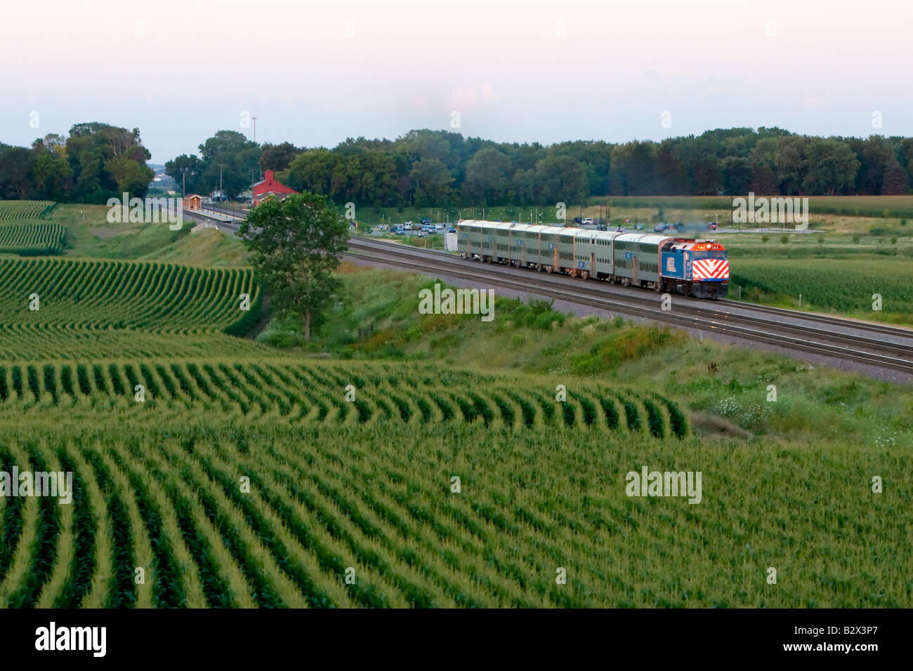 A commuter train makes a stop at a rural suburban station on Chicago's ...