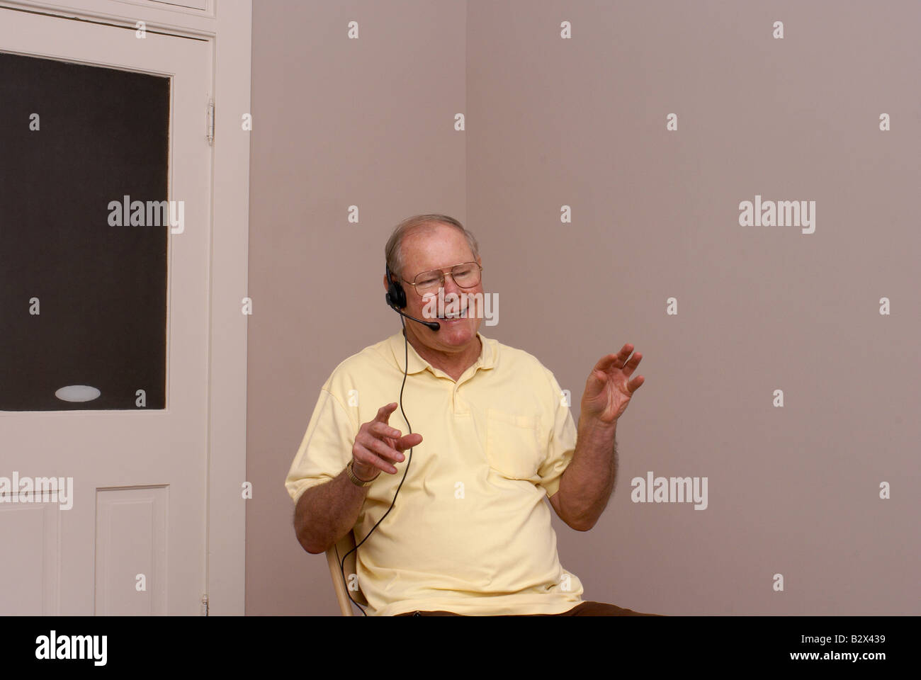 Talking with hands free telephone Stock Photo - Alamy