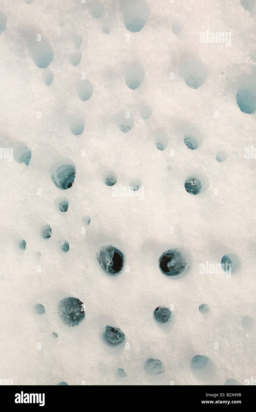 Melt water holes on the Greenland ice sheet near camp Victor north of ...