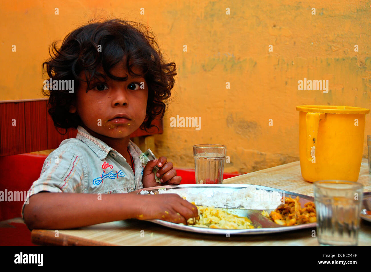Little boy having his dinner in resturant at Khorakhpoore Stock Photo ...
