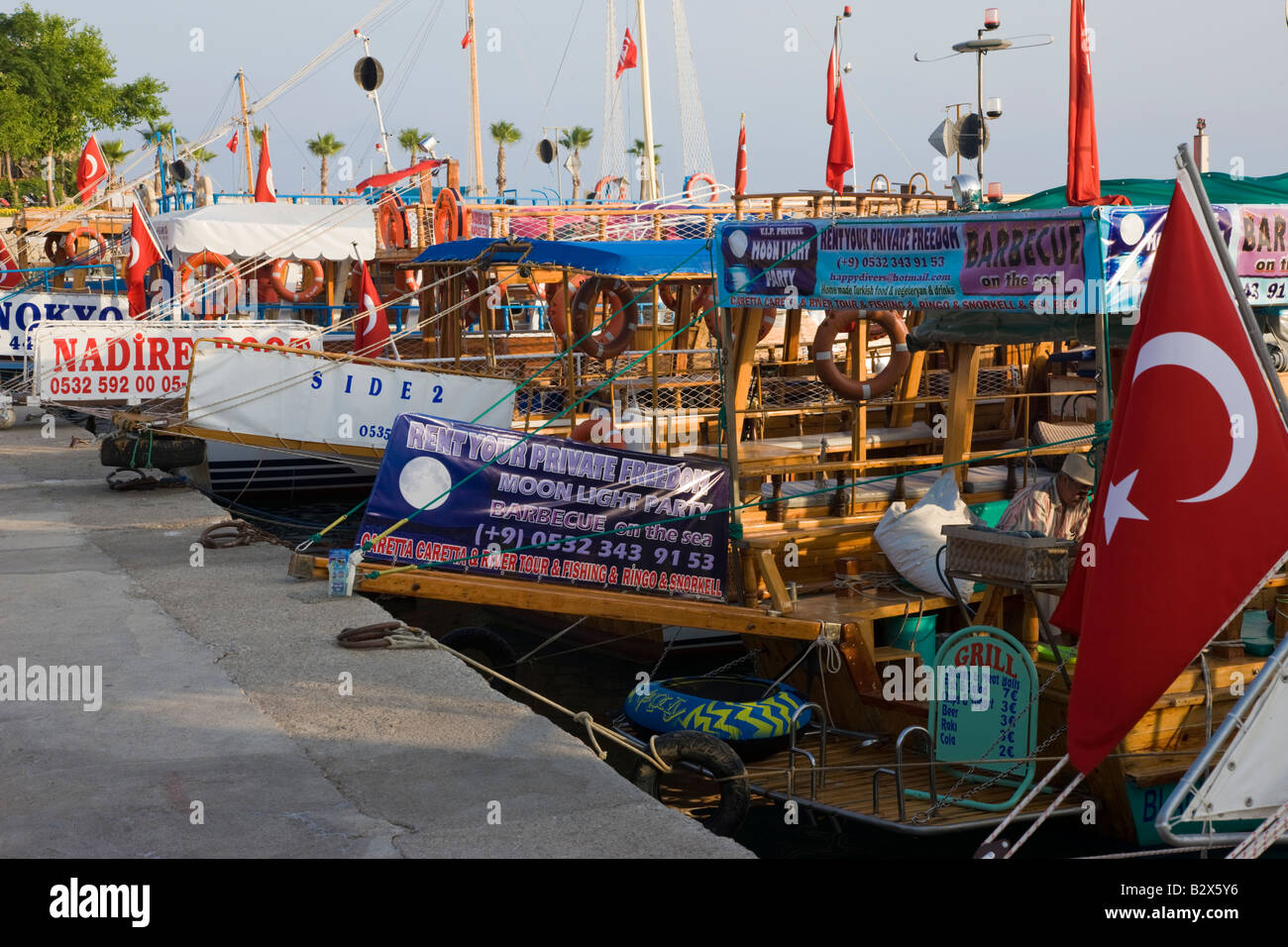 Boats lining the harbourside in Side, Eastern Mediterranean, Turkey ...