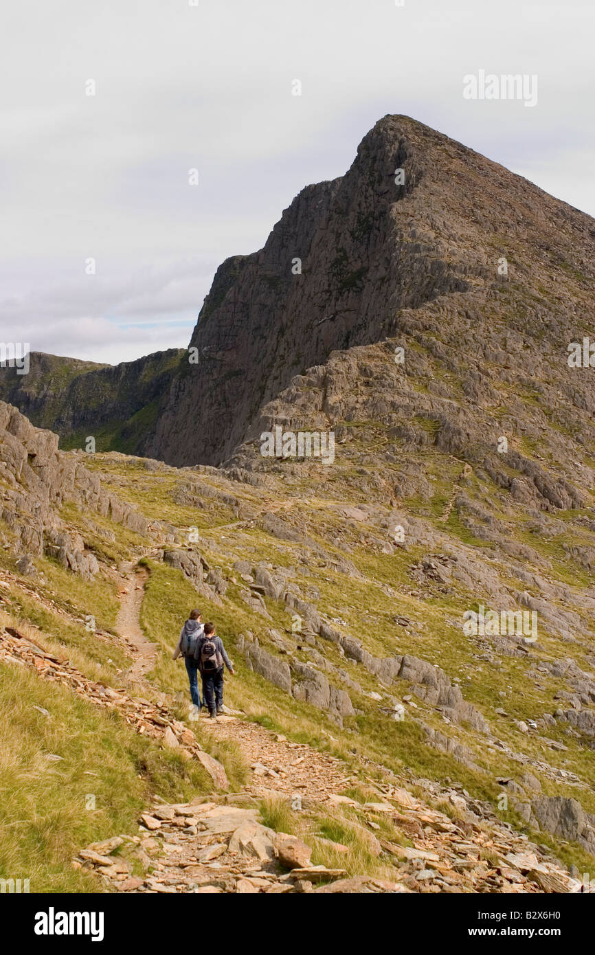 Walkers descending the Watkin path from Snowdon with y Lliwedd in the ...