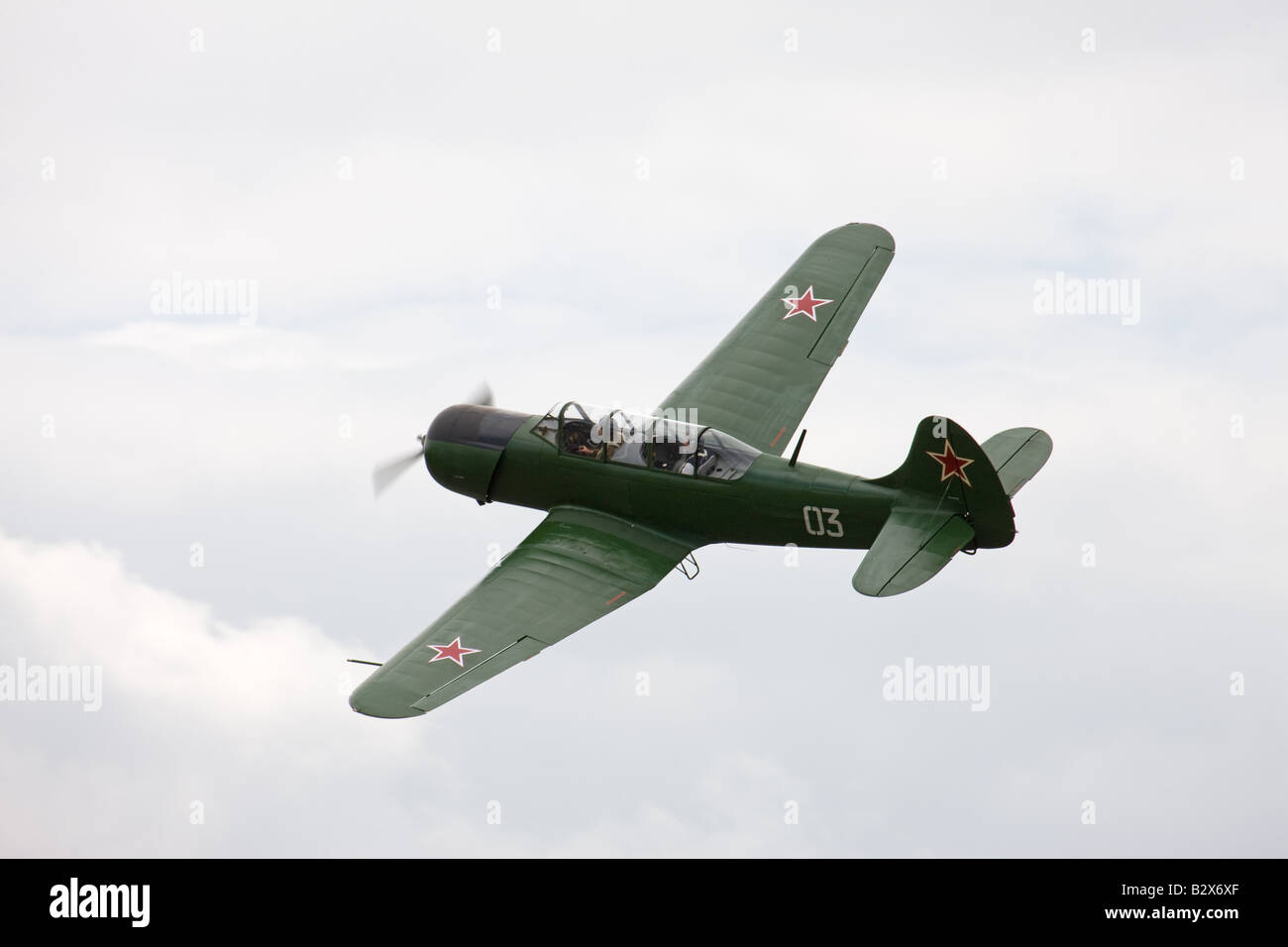 Yak 18A 03 G-CEIB in flight showing upper side at Wickenby Airfield ...