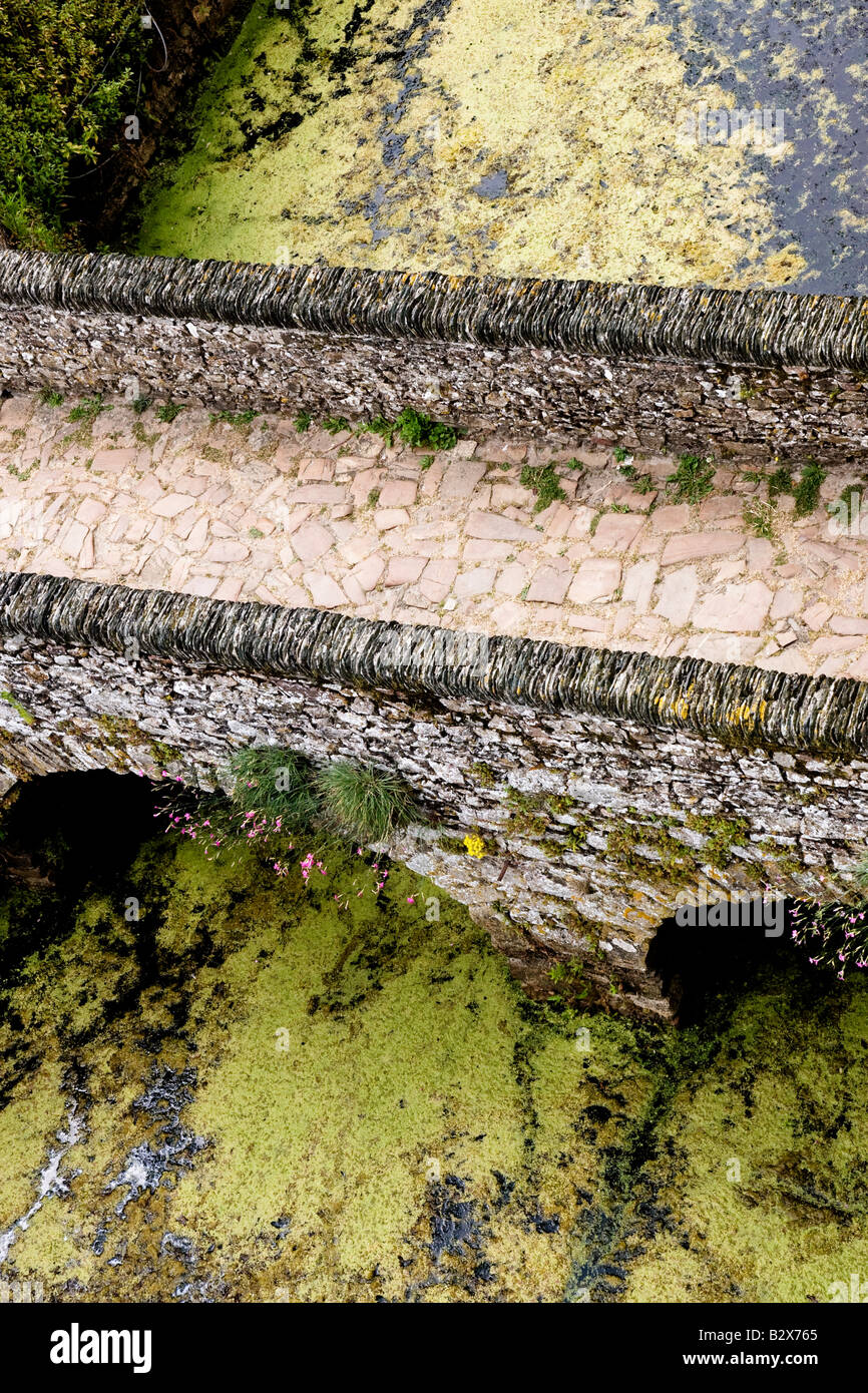Stone bridge over moat in Pirou medieval Castle, Normandy, France Stock ...