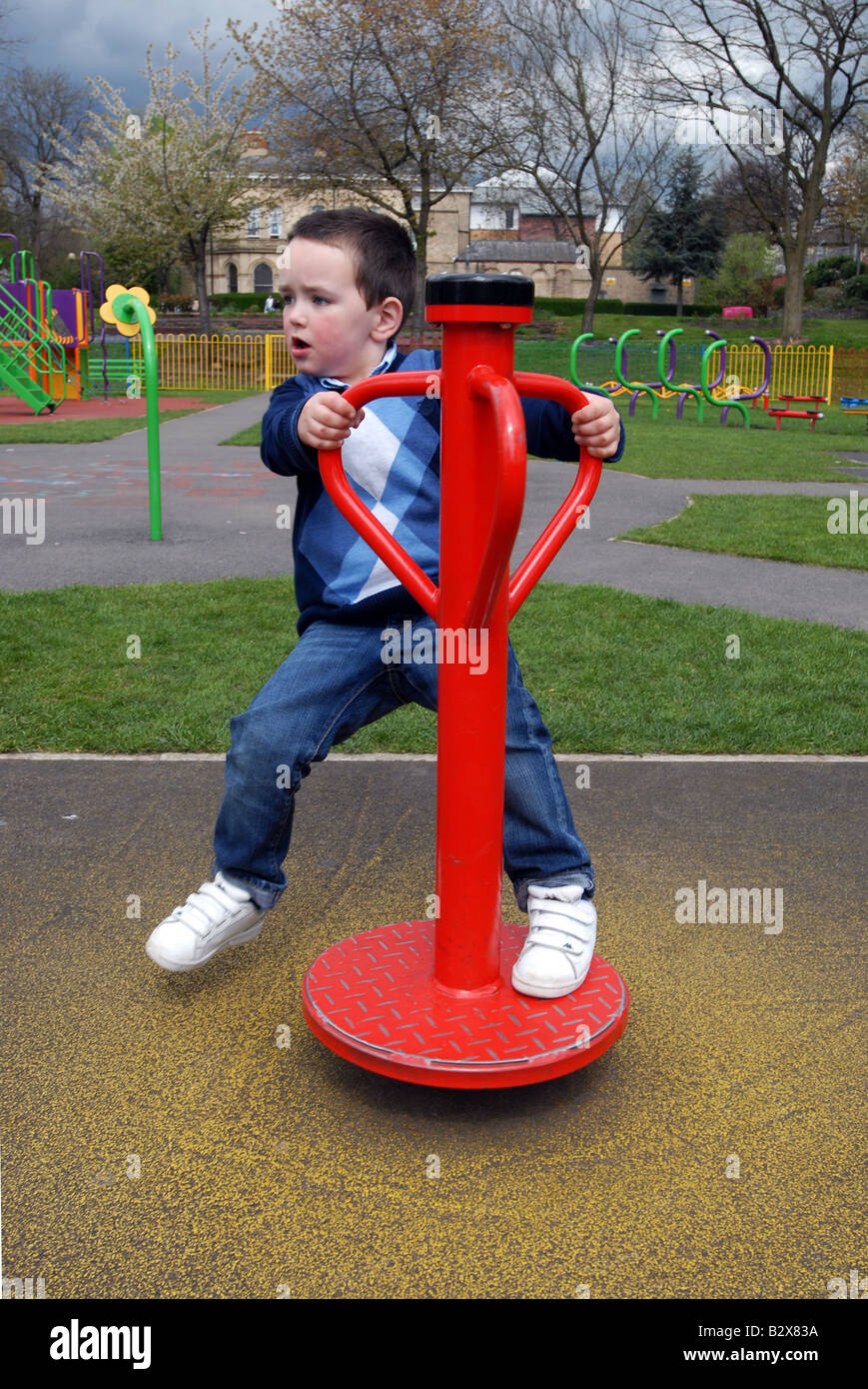 Child on Roundabout Stock Photo - Alamy