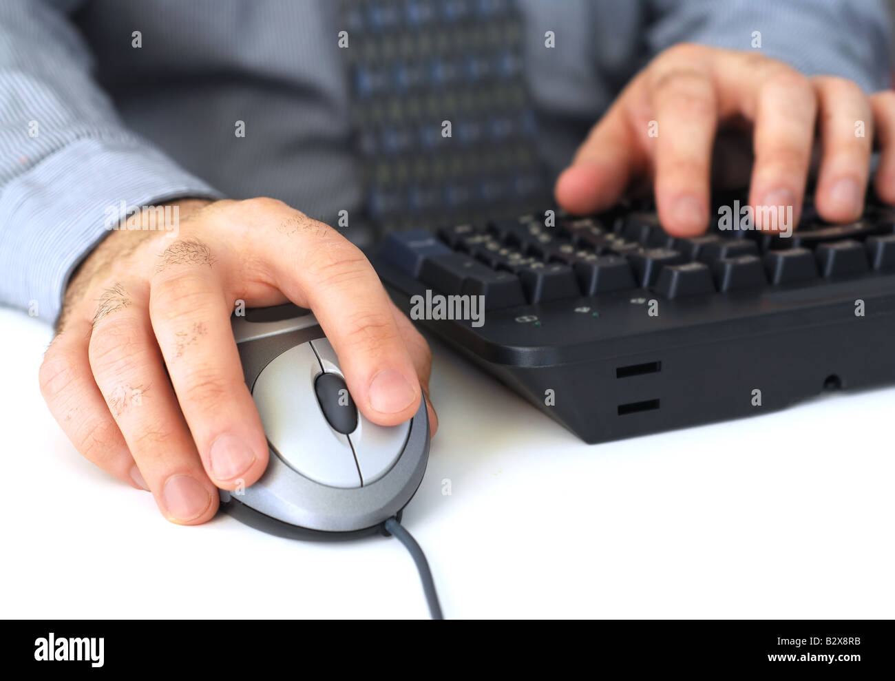 Closeup of man s hands with computer mouse and keyboard Stock Photo - Alamy