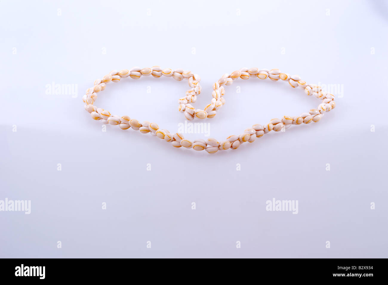 A shell necklace from Fiji shaped into a heart Stock Photo - Alamy