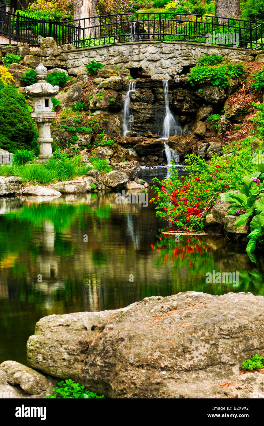 Cascading waterfall and pond in japanese garden Stock Photo - Alamy
