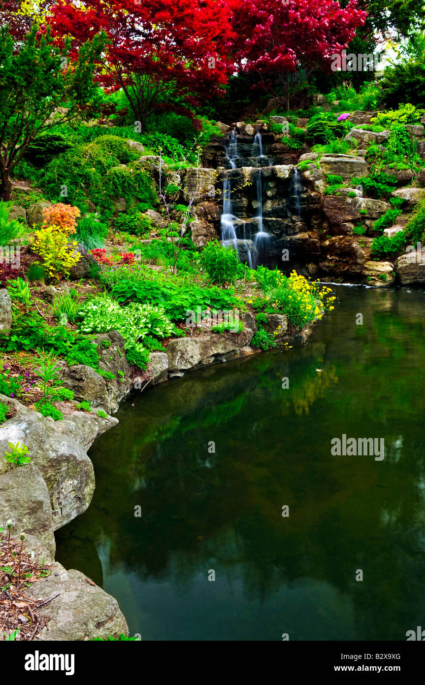 Cascading waterfall and pond in japanese garden Stock Photo - Alamy