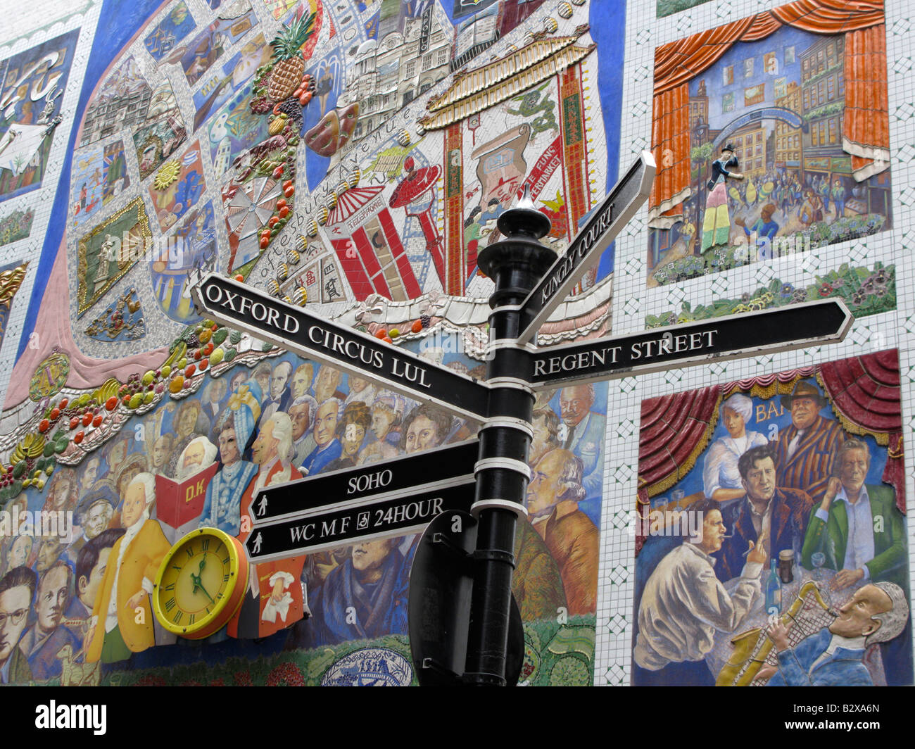 Road Signs indicating tourist attractions and Large Mural on Wall off ...