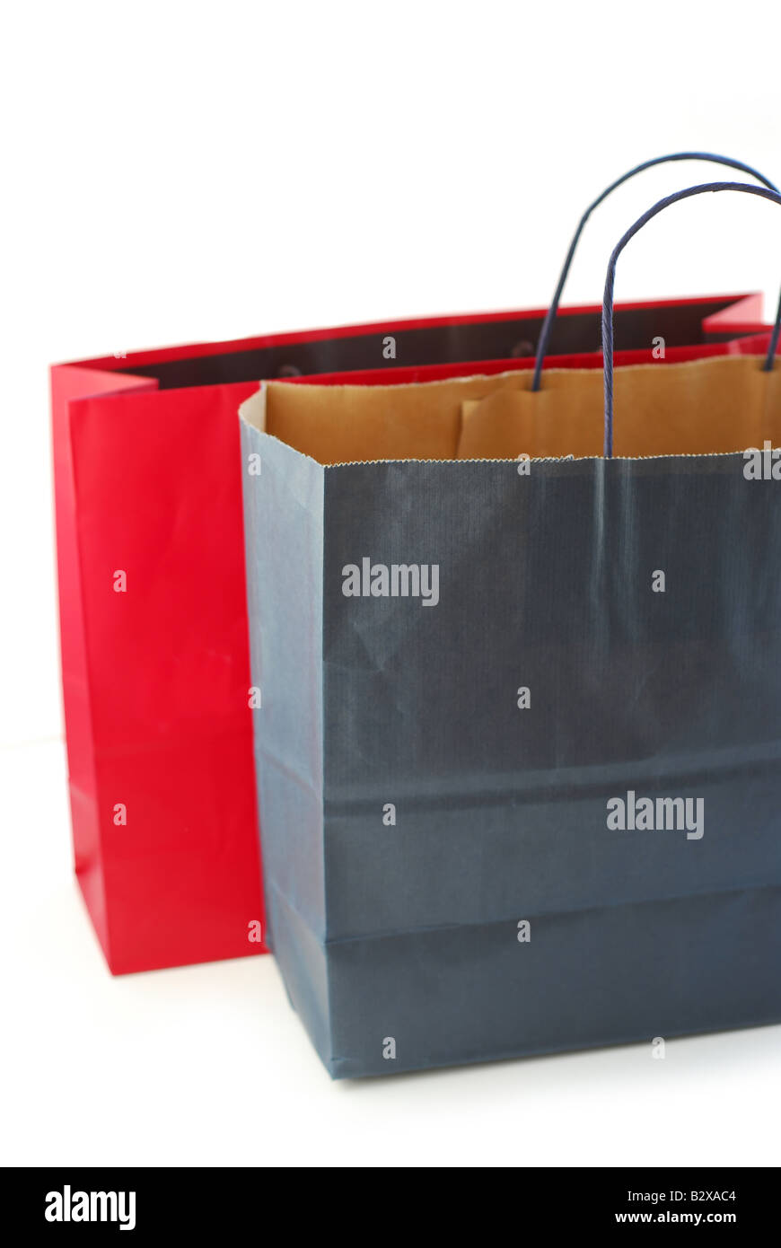 Two paper shopping bags isolated on white background Stock Photo - Alamy