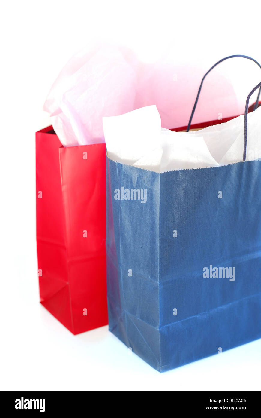 Two paper shopping bags isolated on white background Stock Photo - Alamy