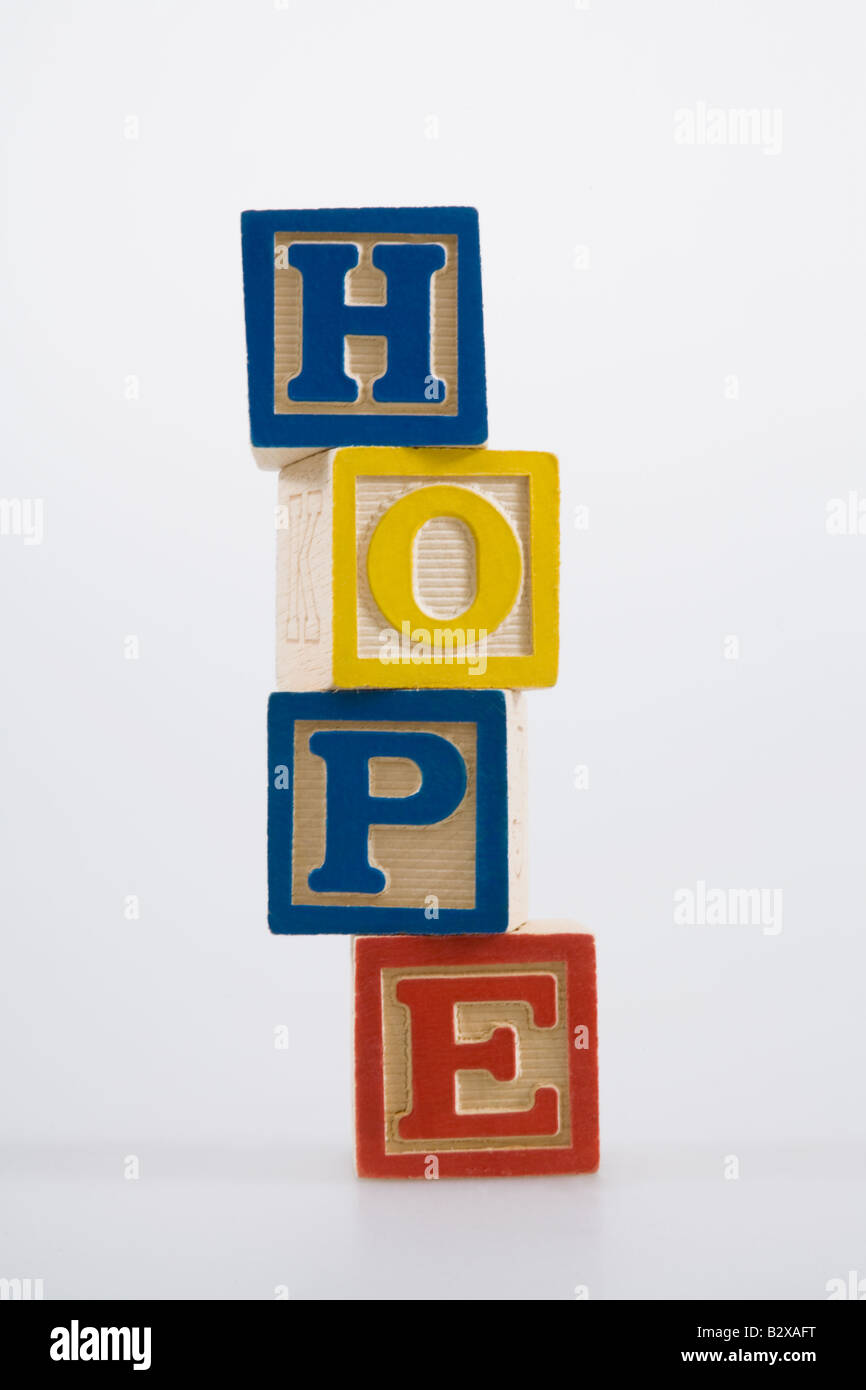 Four wooden blocks spelling hope Stock Photo - Alamy